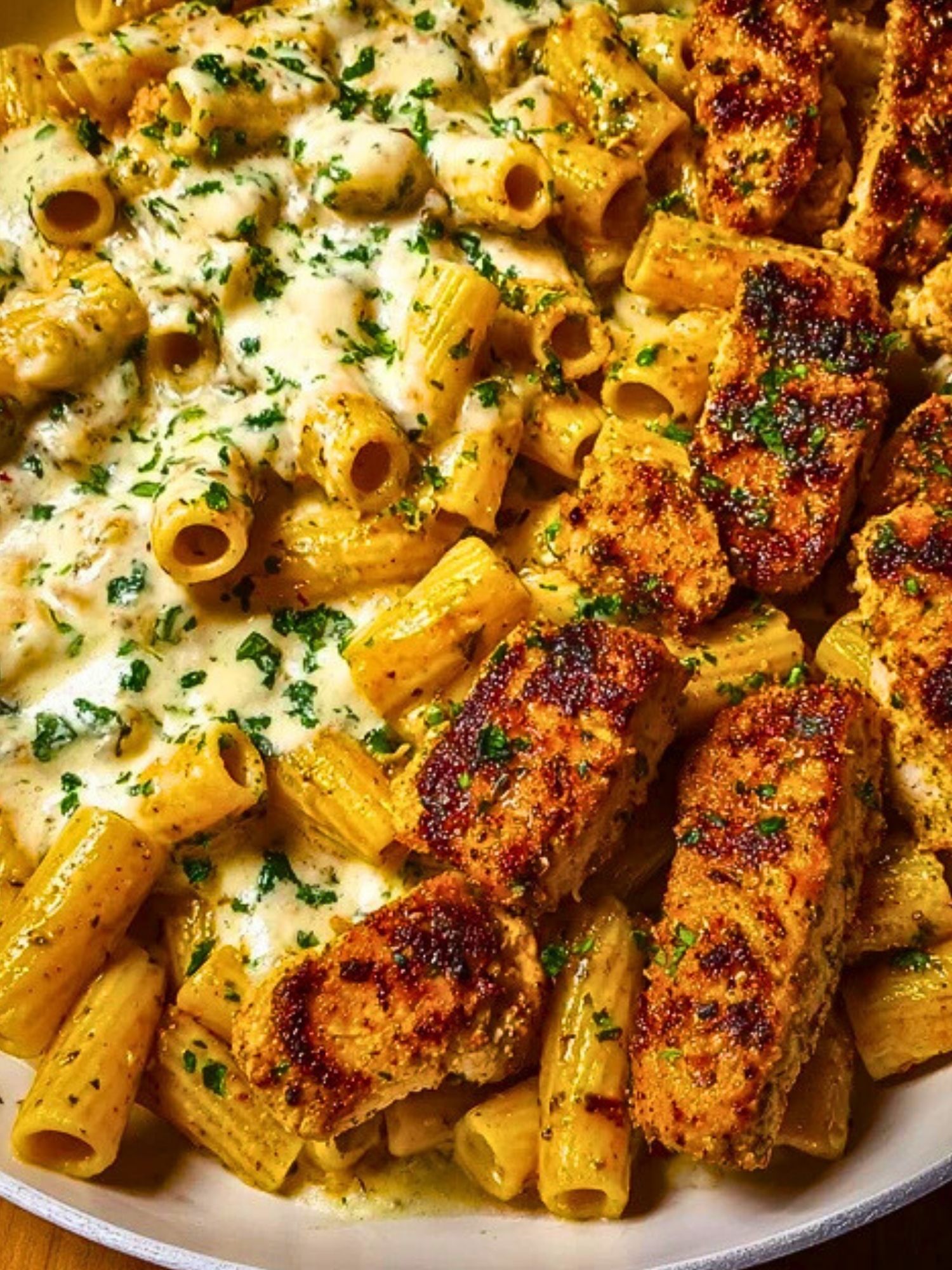 Spicy Cajun Chicken Rigatoni in Creamy Mozzarella Alfredo